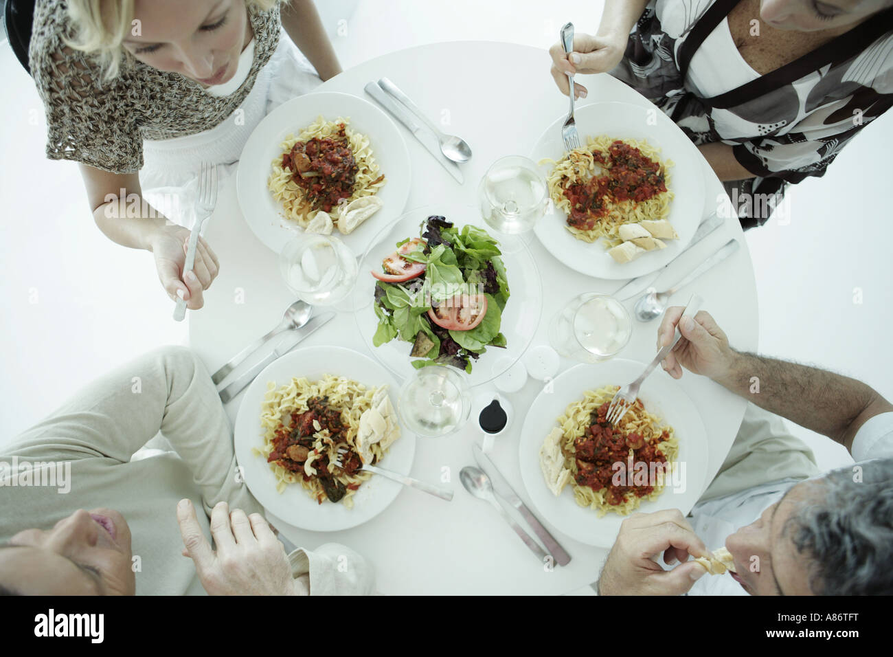Aerial view of four people eating Stock Photo - Alamy