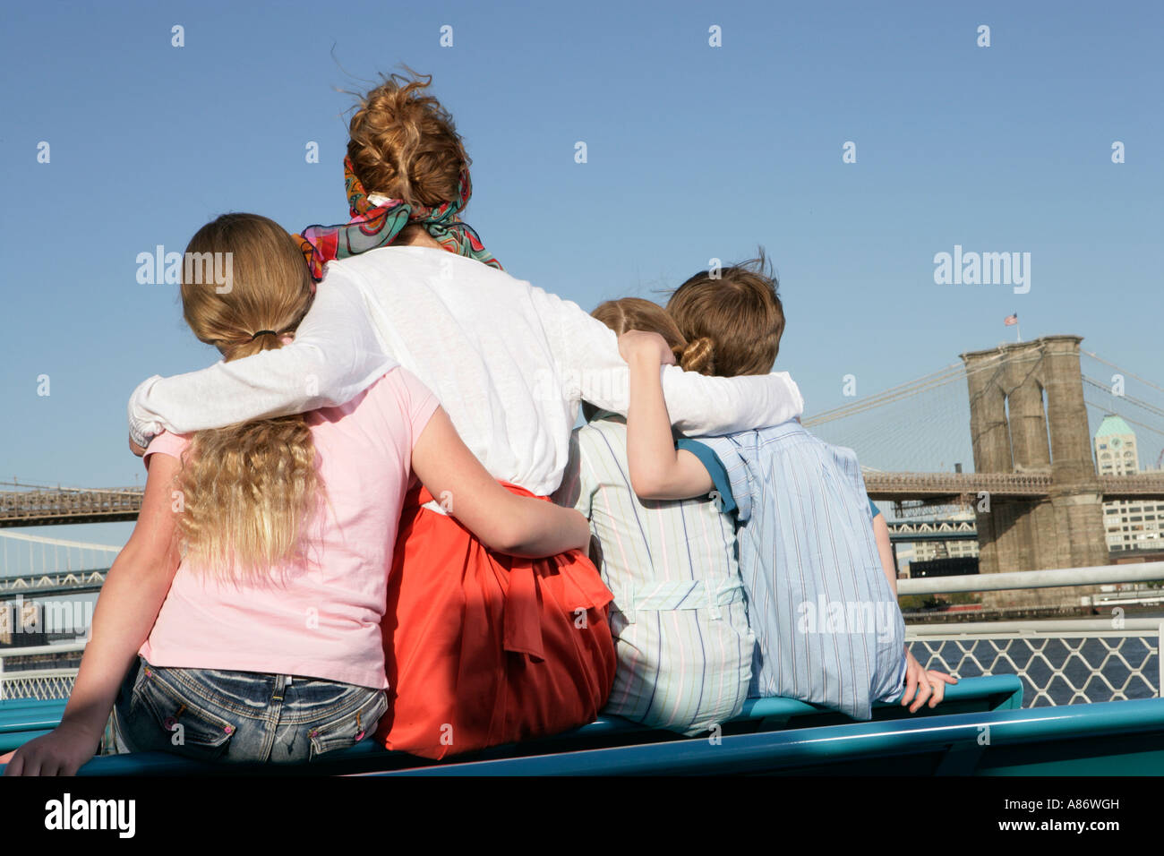 Back view of a family sitting on a ferry Stock Photo - Alamy
