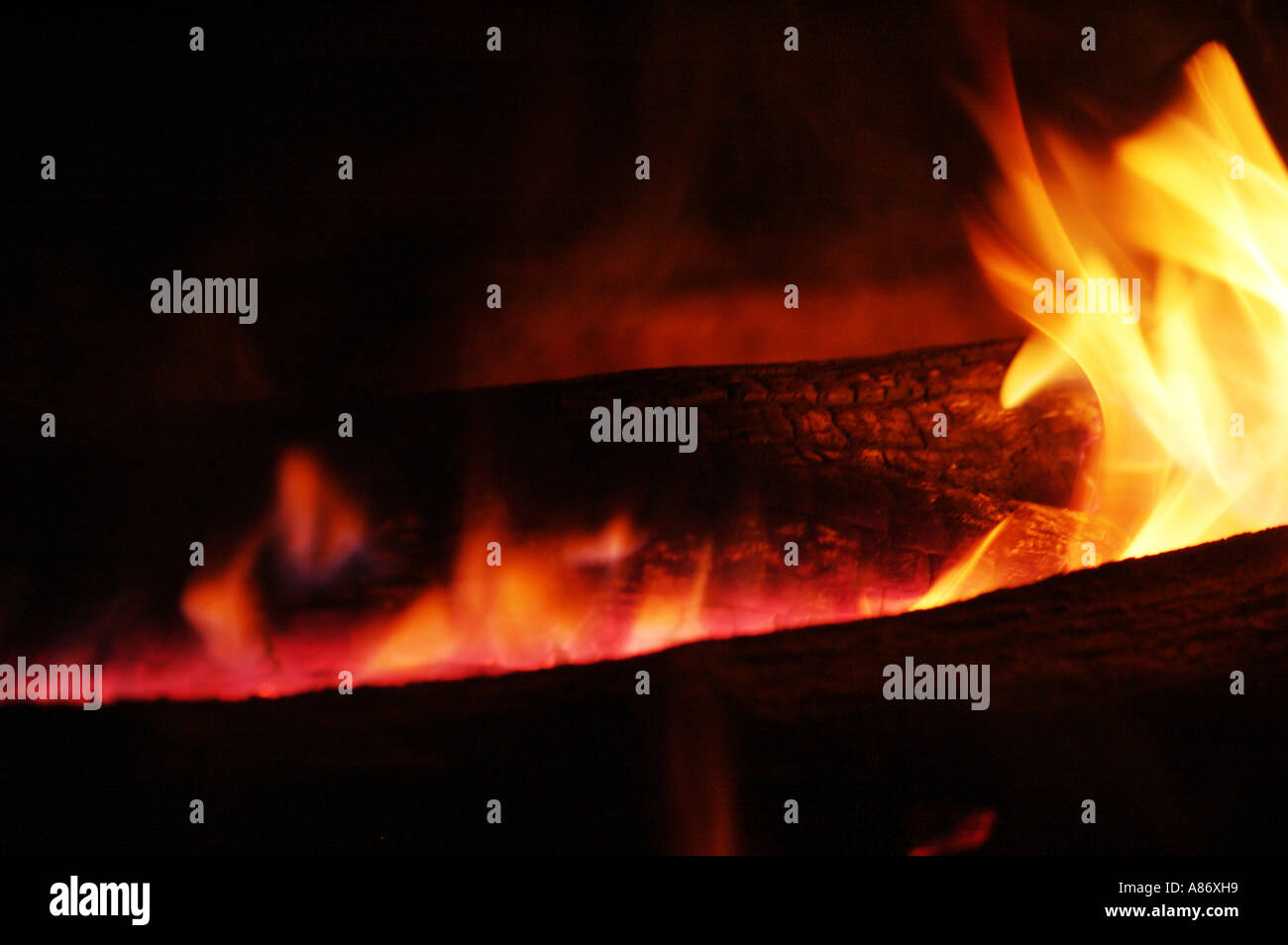 Masai camp fire smouldering in the Masai Mara National Park, Kenya ...