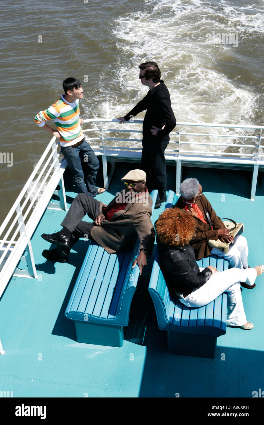 Passengers on board a boat Stock Photo - Alamy