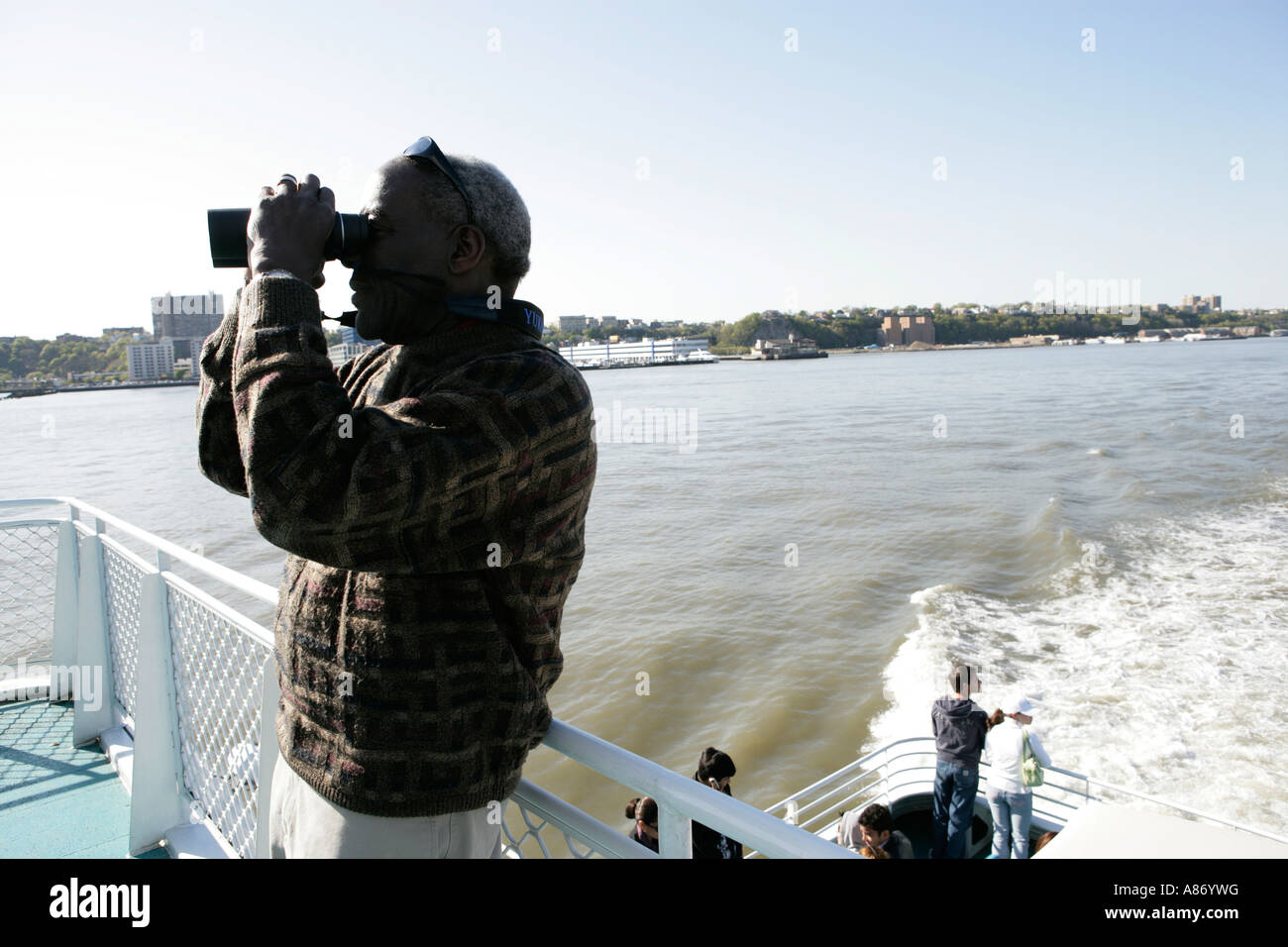 Man using binoculars Stock Photo - Alamy