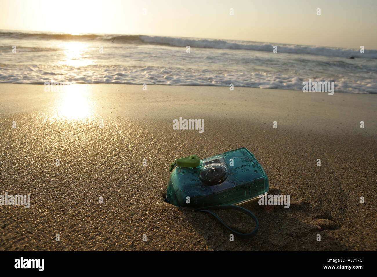 View of sunset from a beach with camera in sand Stock Photo - Alamy
