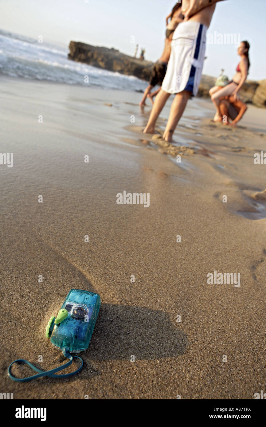 View of a camera lying on a beach Stock Photo - Alamy