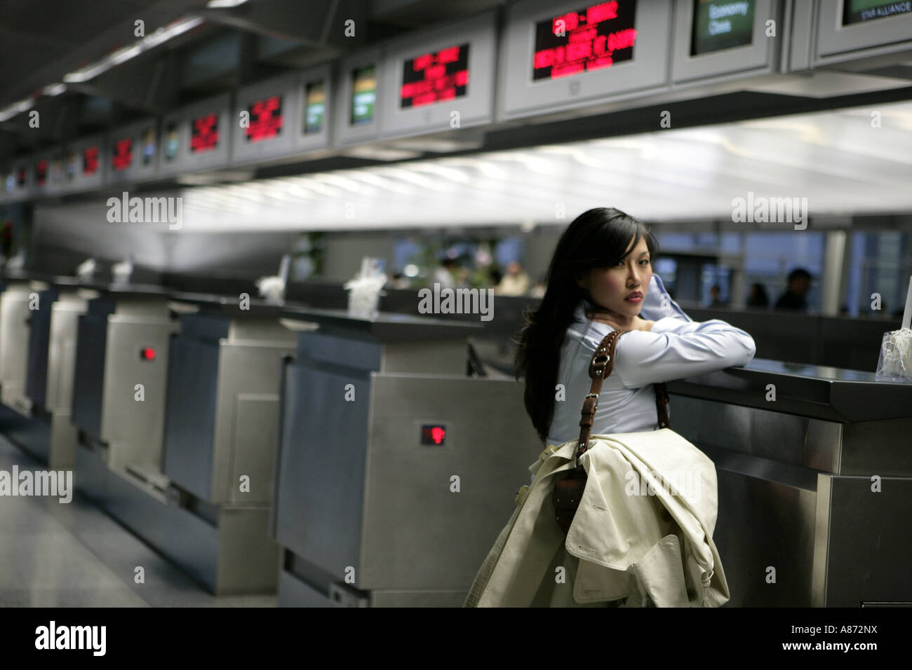 A woman waits at a counter Stock Photo - Alamy