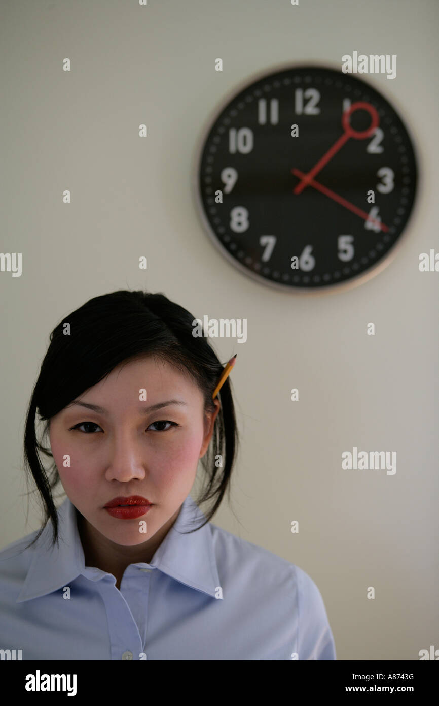 Young woman and clock, portrait Stock Photo - Alamy