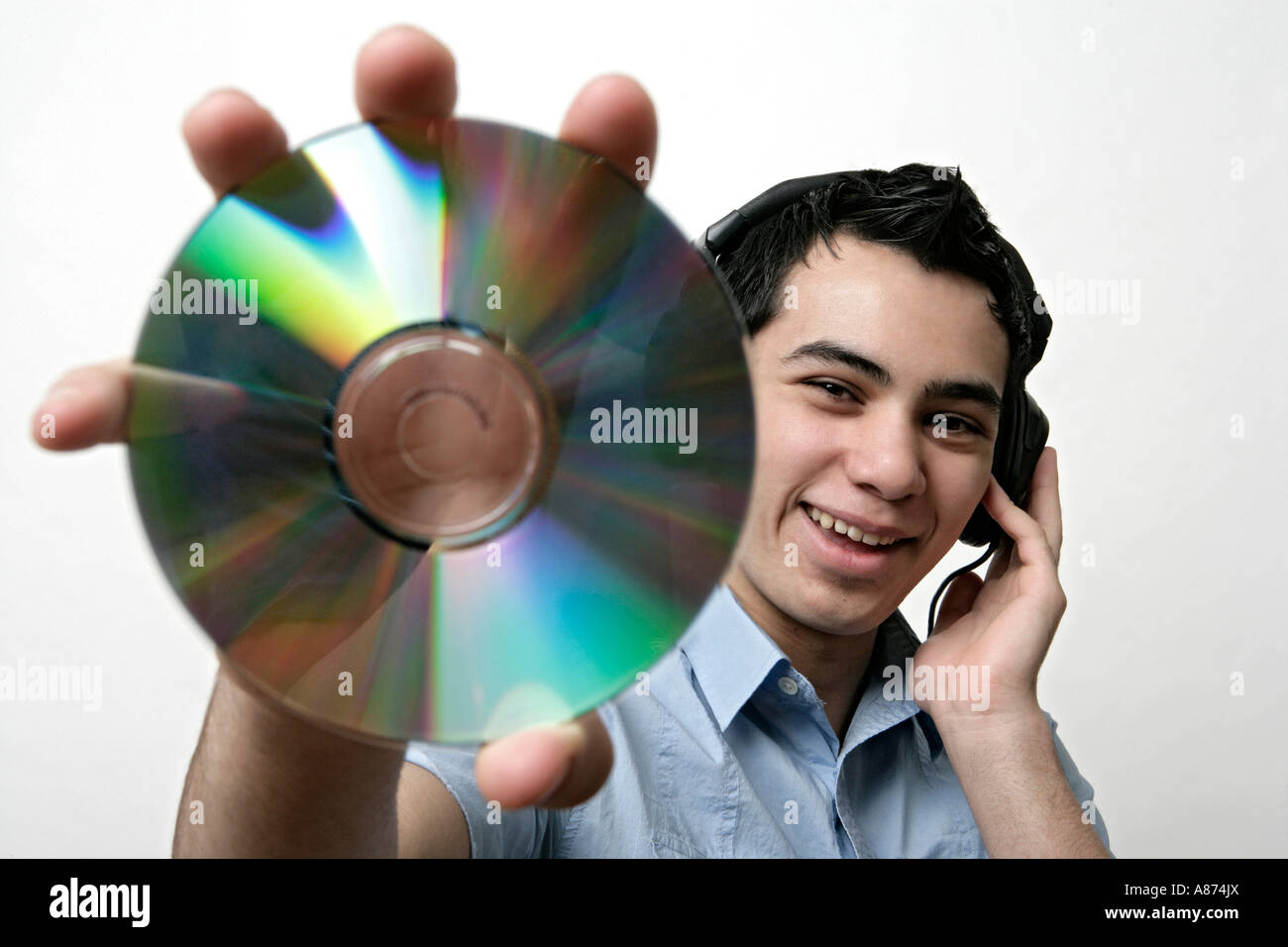 View of a teenage boy holding a CD Stock Photo - Alamy