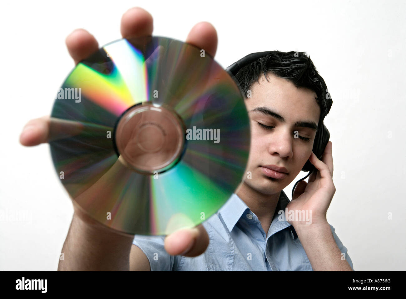 View of a teenage boy holding a CD Stock Photo - Alamy