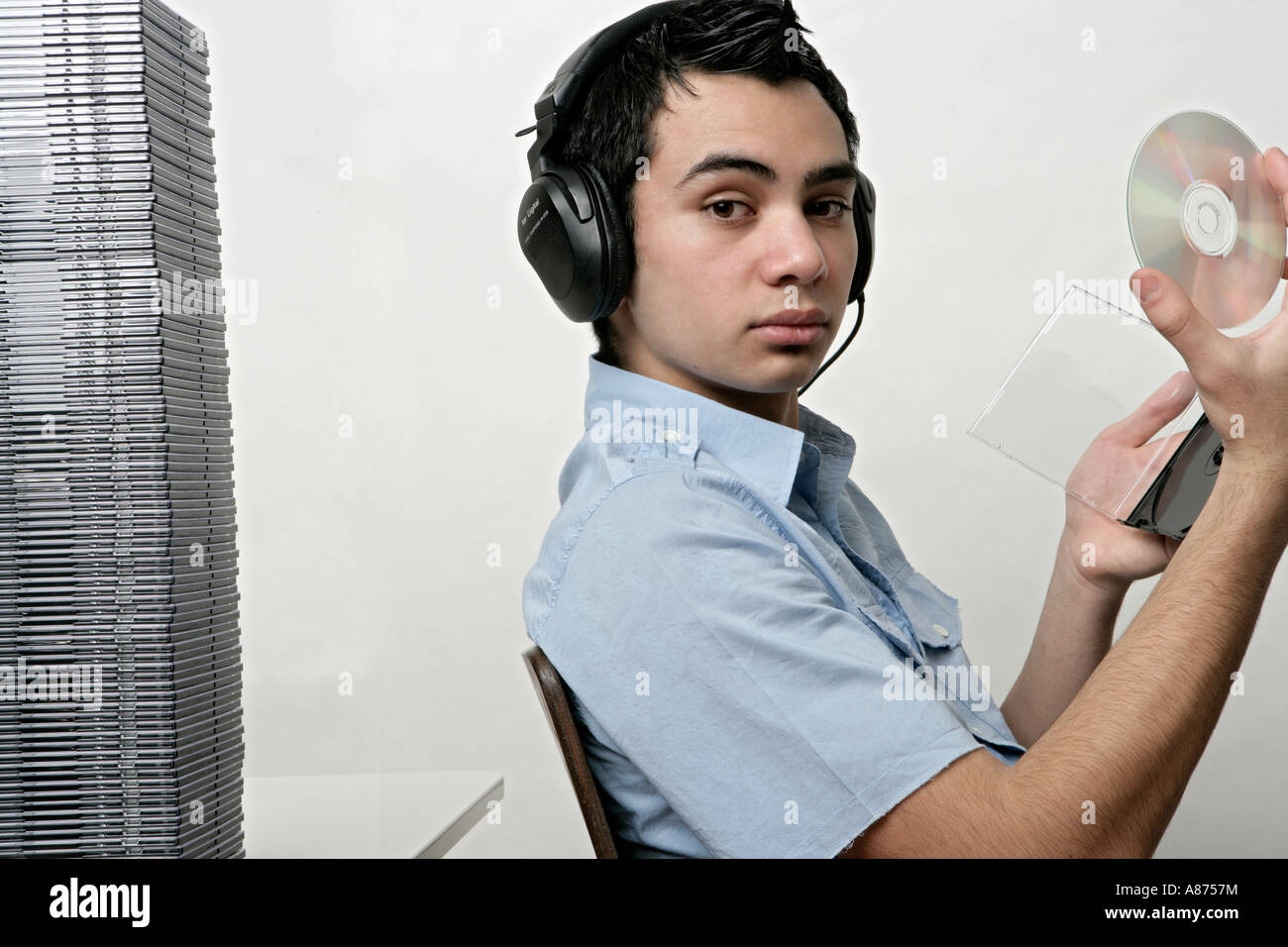 View of a teenage boy holding a CD Stock Photo - Alamy