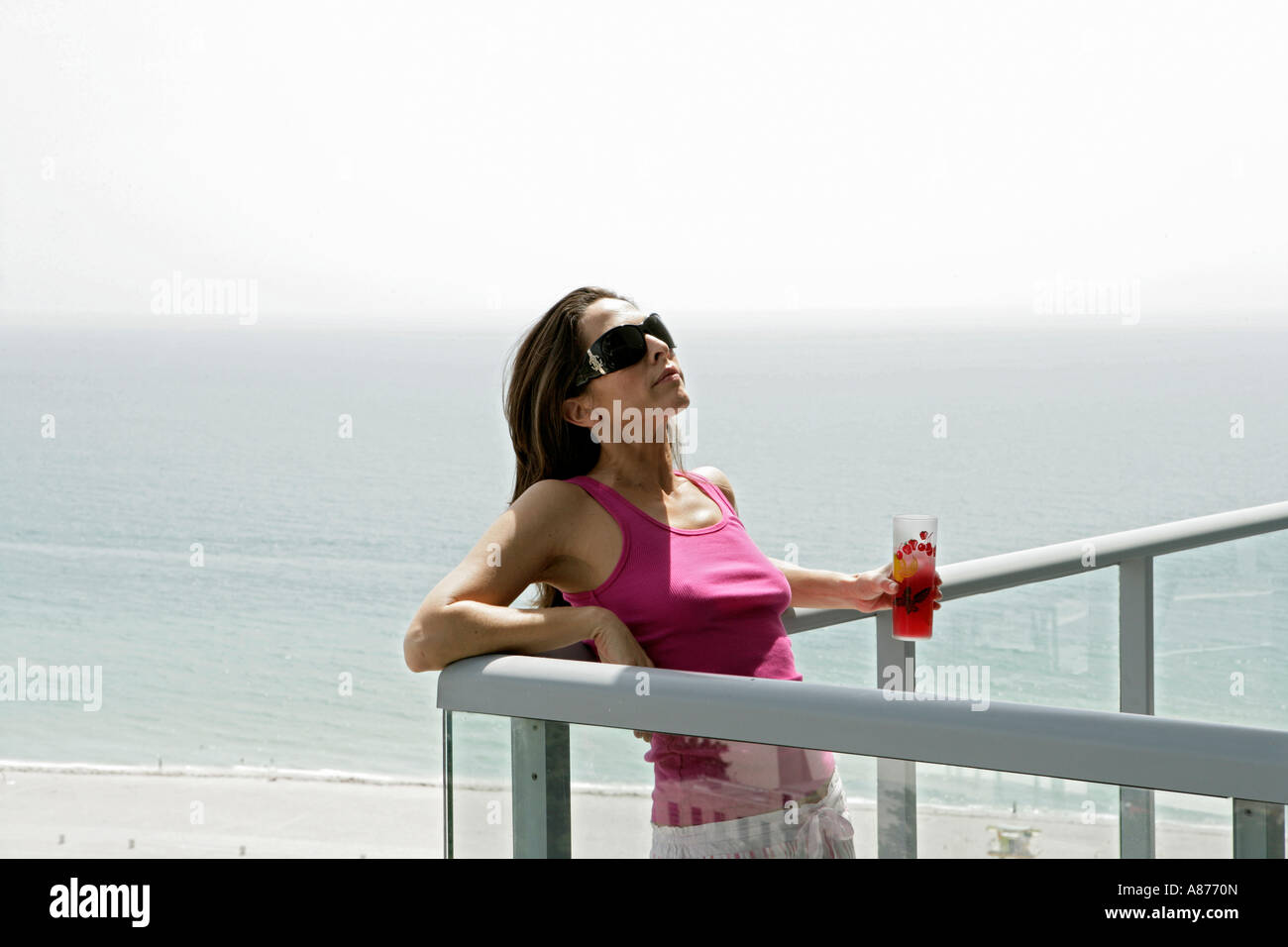 View of a woman in a balcony Stock Photo - Alamy