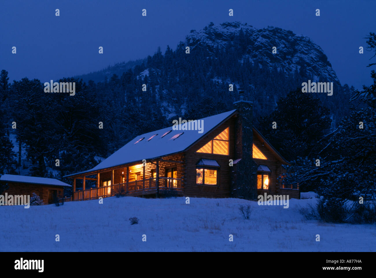 Log cabin at night in the snow Property released Stock Photo - Alamy