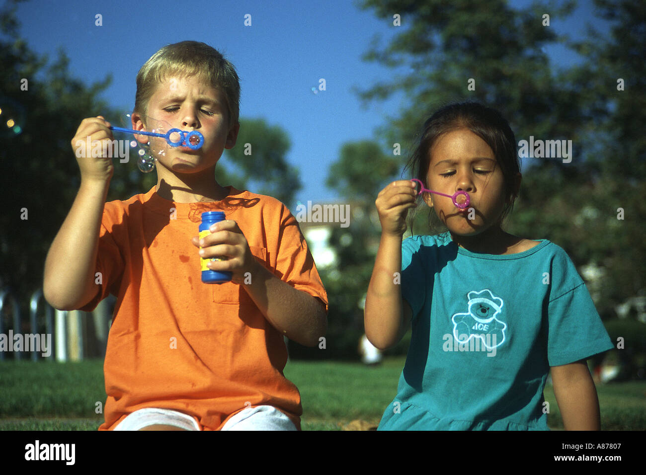 Boy boys male child children childhood kid kids playing hi-res stock ...