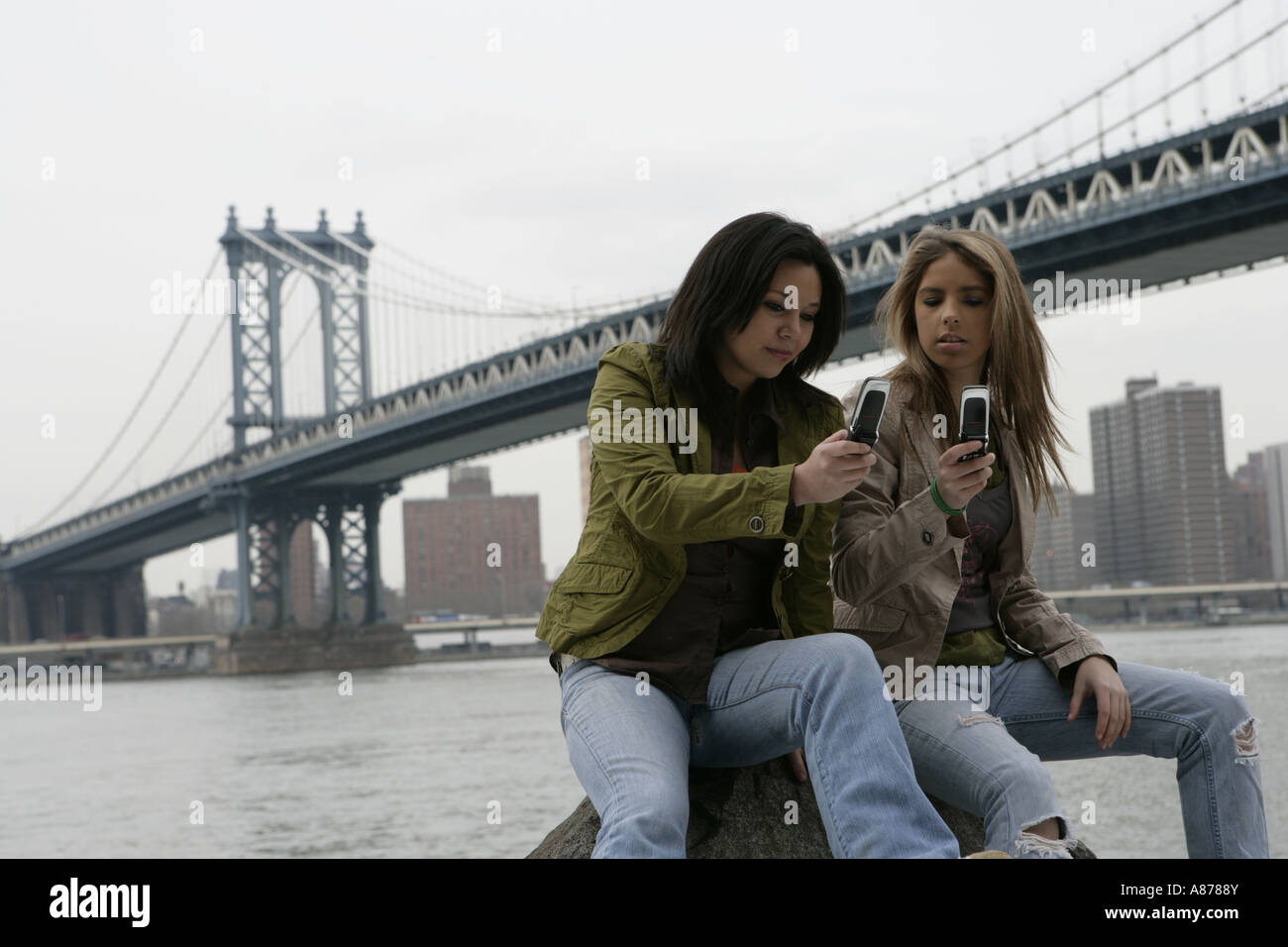 Portrait of two women with its cell phones Stock Photo - Alamy