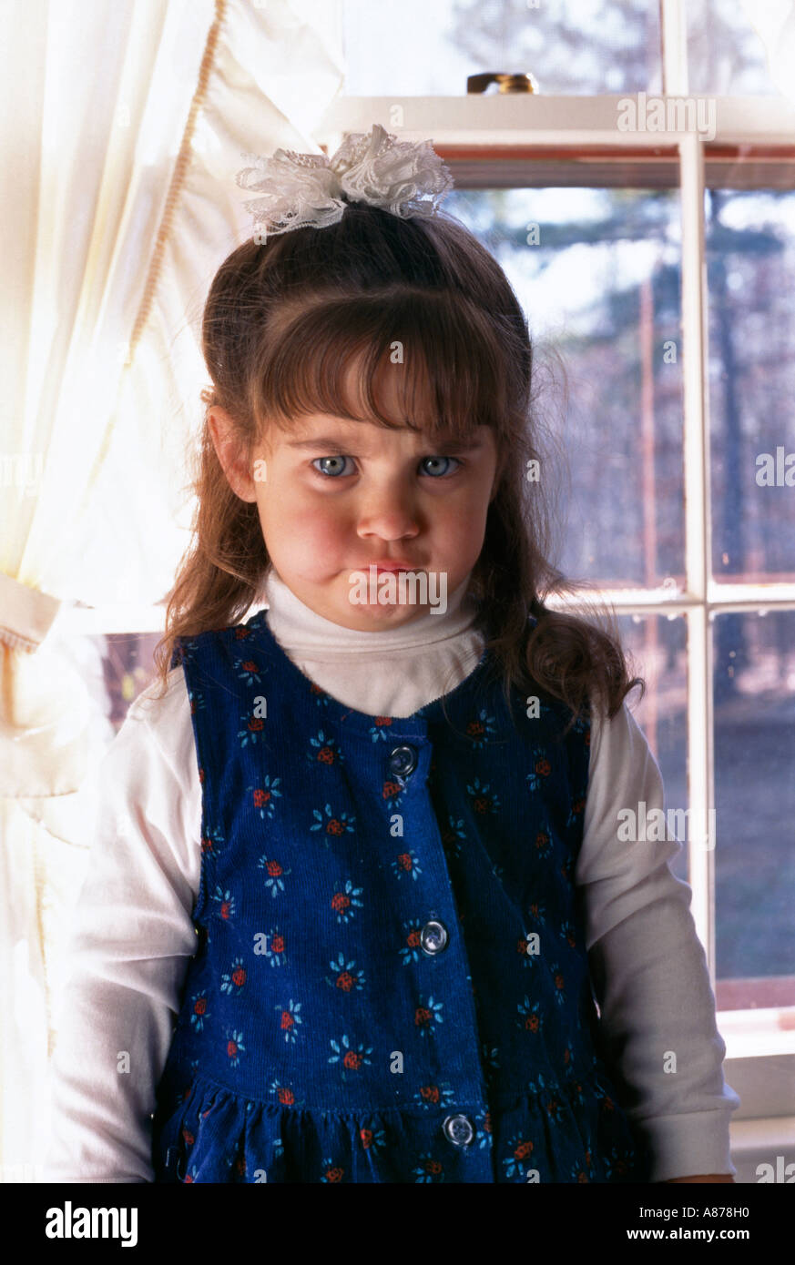 Young girl looking stern pouting MR Stock Photo - Alamy