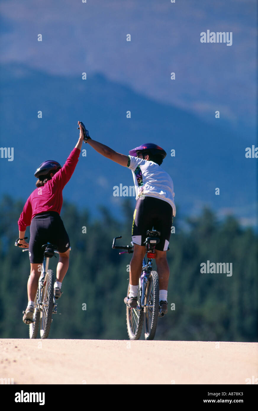 Two people mountain biking Stock Photo - Alamy