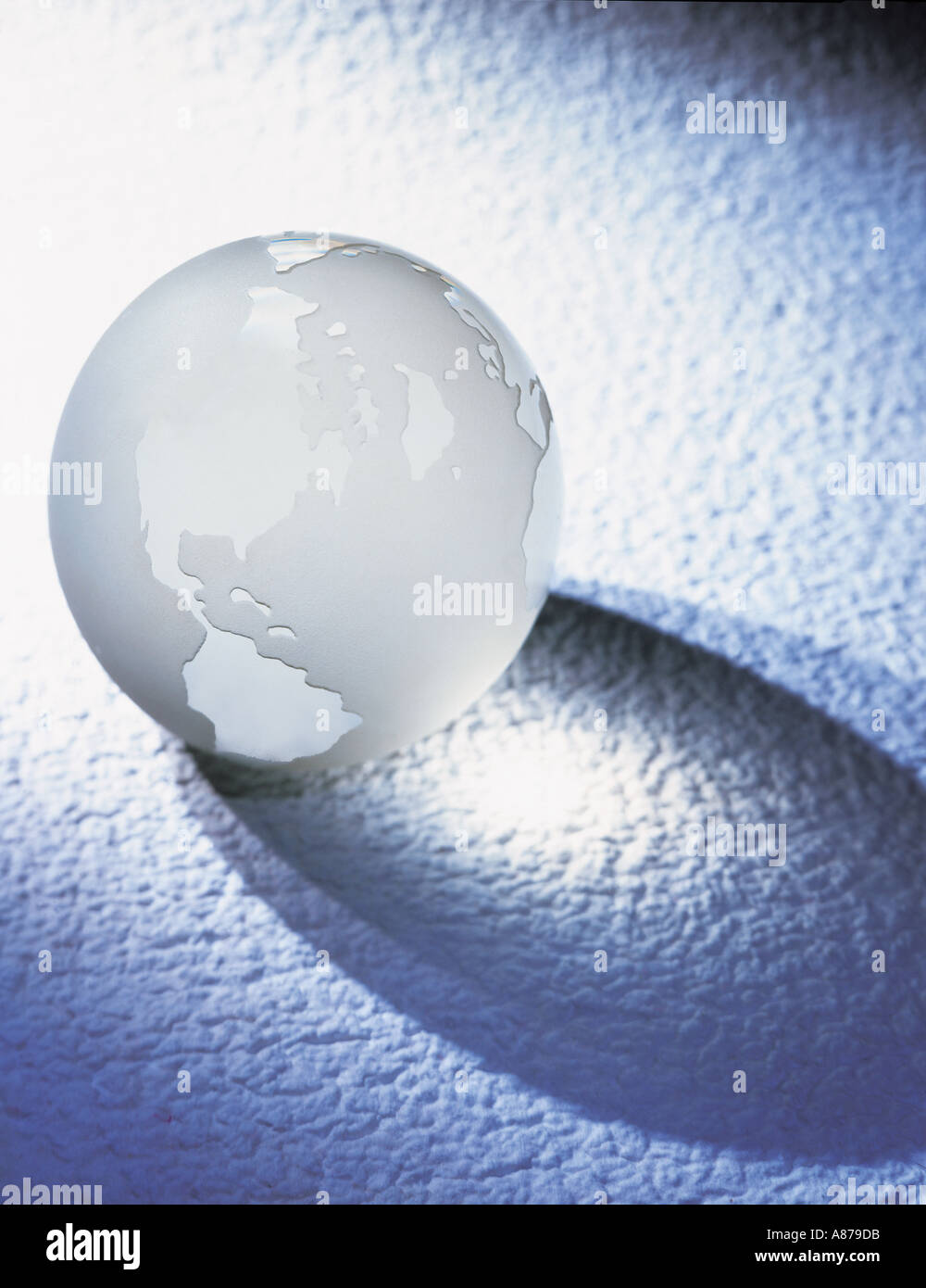 Glass globe with bright light casting a shadow Stock Photo - Alamy