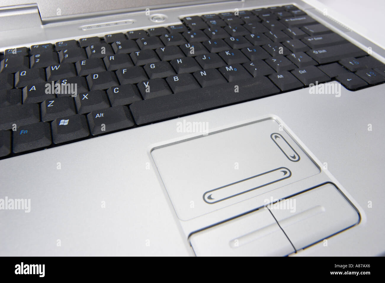 Open laptop notebook computer with focus on keyboard and touchpad input ...