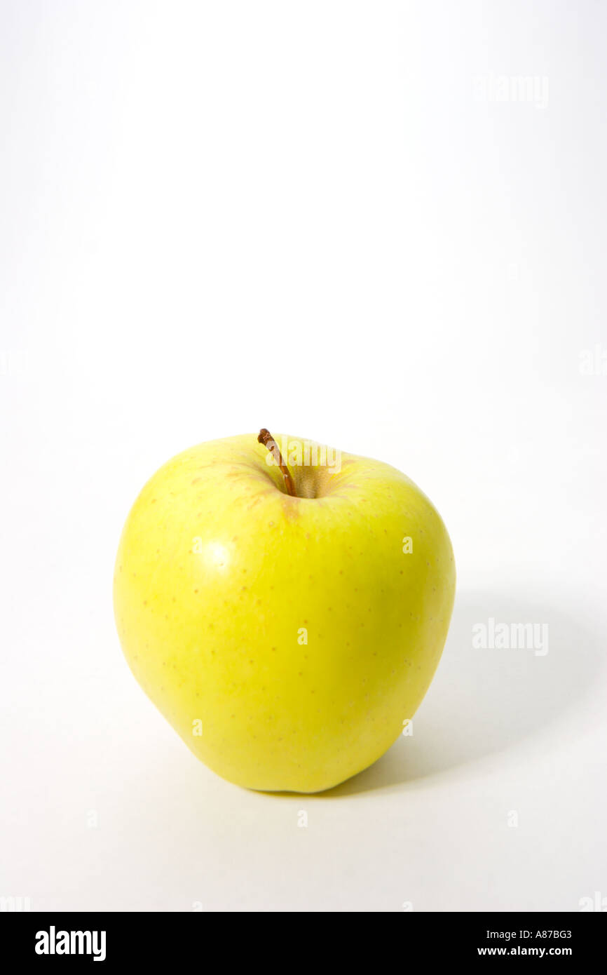 One bright yellow apple on white background Stock Photo - Alamy