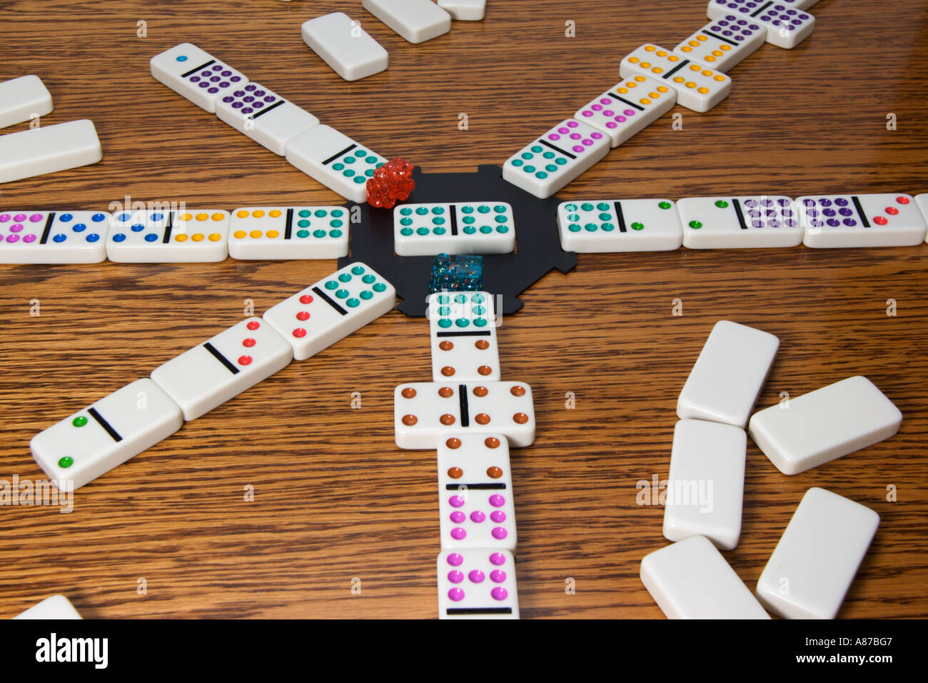 Mexican Train domino game played with brightly colored dominoes on a ...