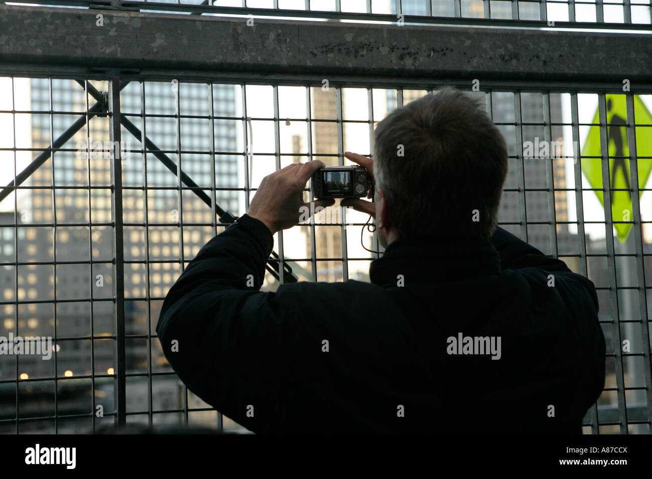 Back view of a mature man taking a picture Stock Photo - Alamy