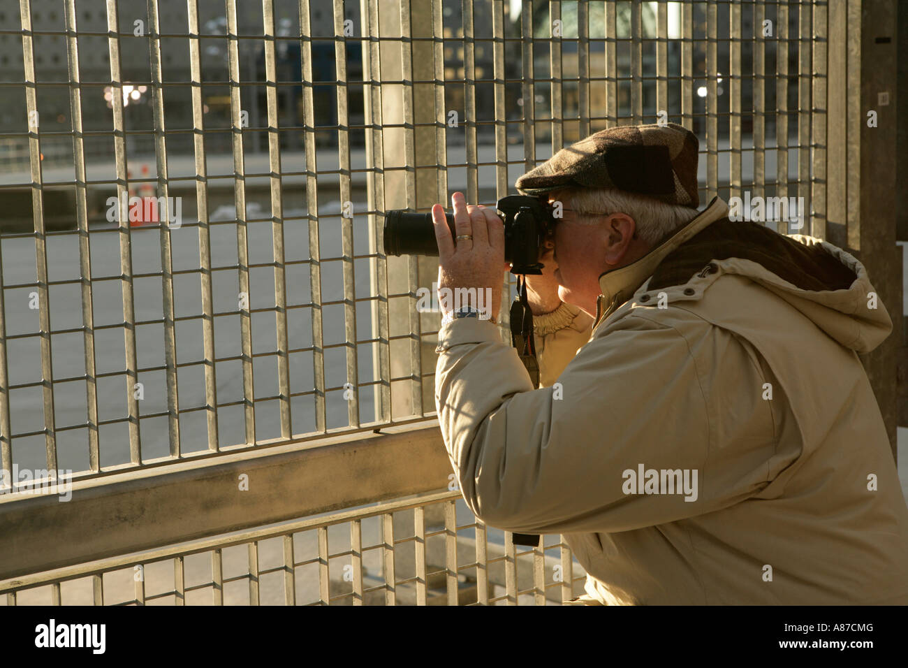 Mature man snapping photo Stock Photo - Alamy