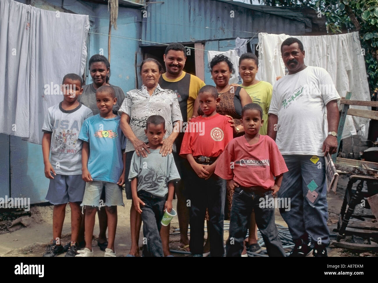 Portrait of an extended Dominican family in front of their home on the ...