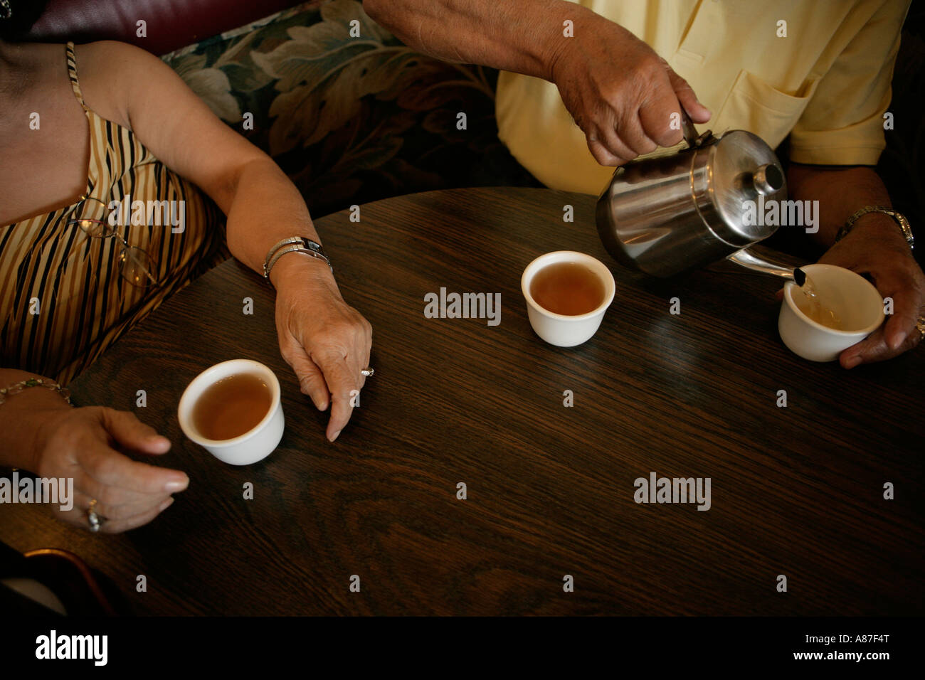 Couple having tea, elevated view Stock Photo - Alamy