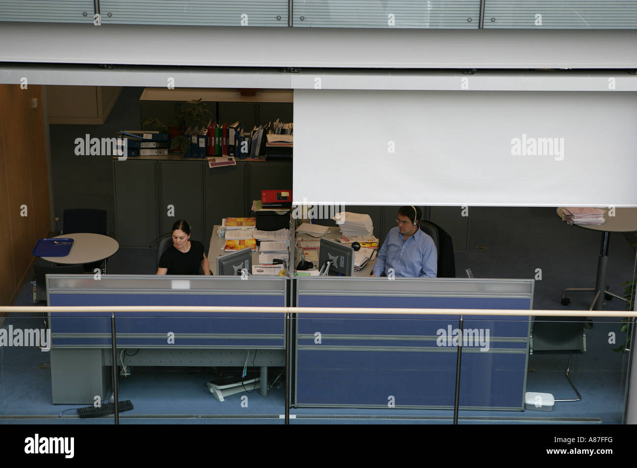 Two people working in office, elevated view Stock Photo - Alamy