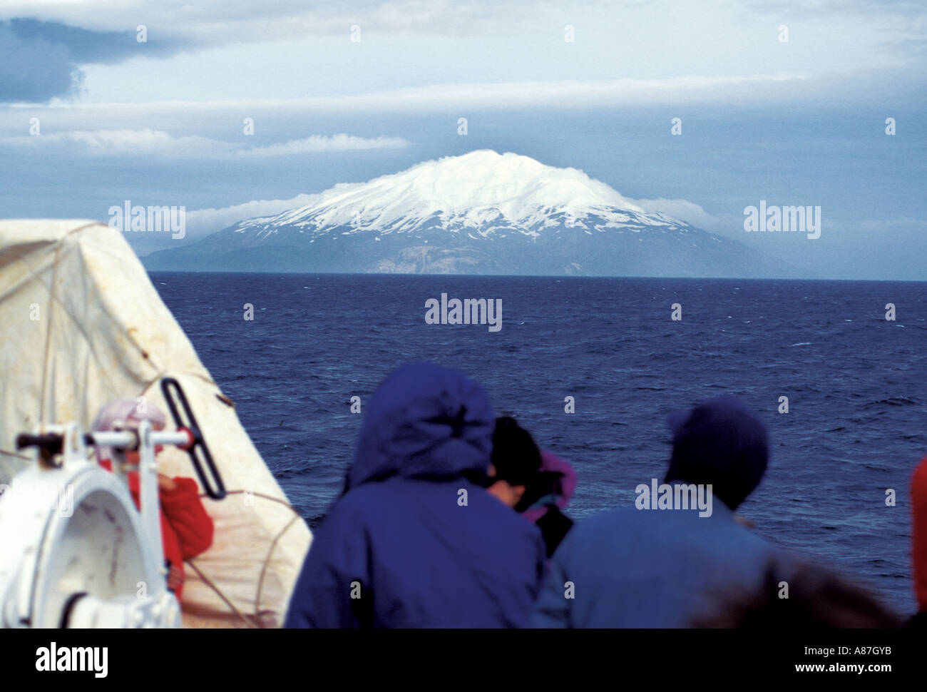 Birders on ship looking at rare clear view of Kiska Volcano Stock Photo ...