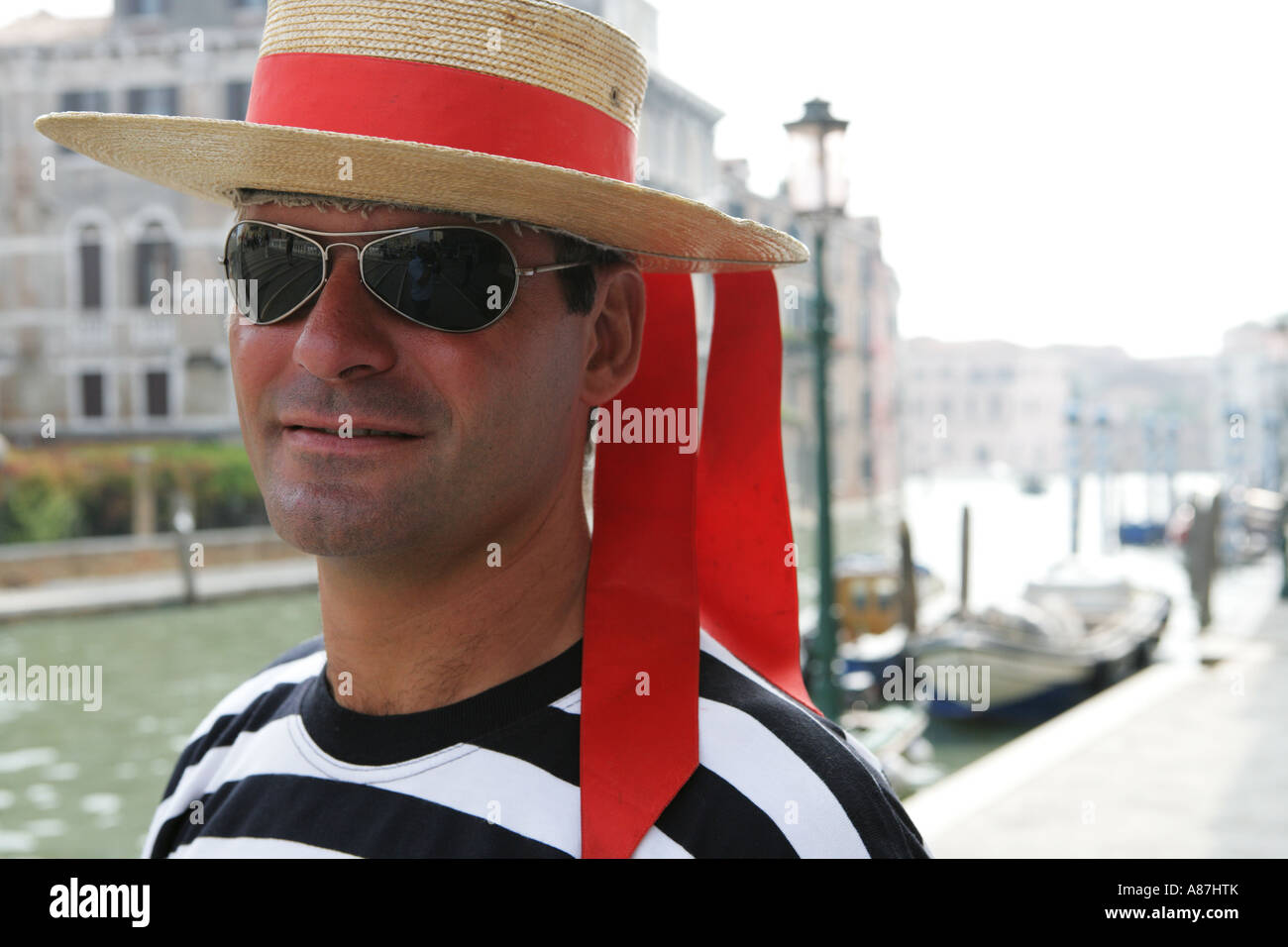 Man wearing straw hat and sunglasses, portrait, close-up Stock Photo ...