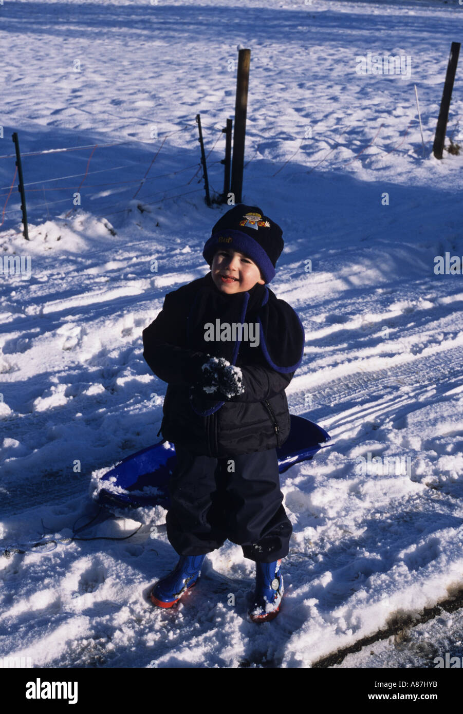 Boy In Snow in the Uk Stock Photo - Alamy