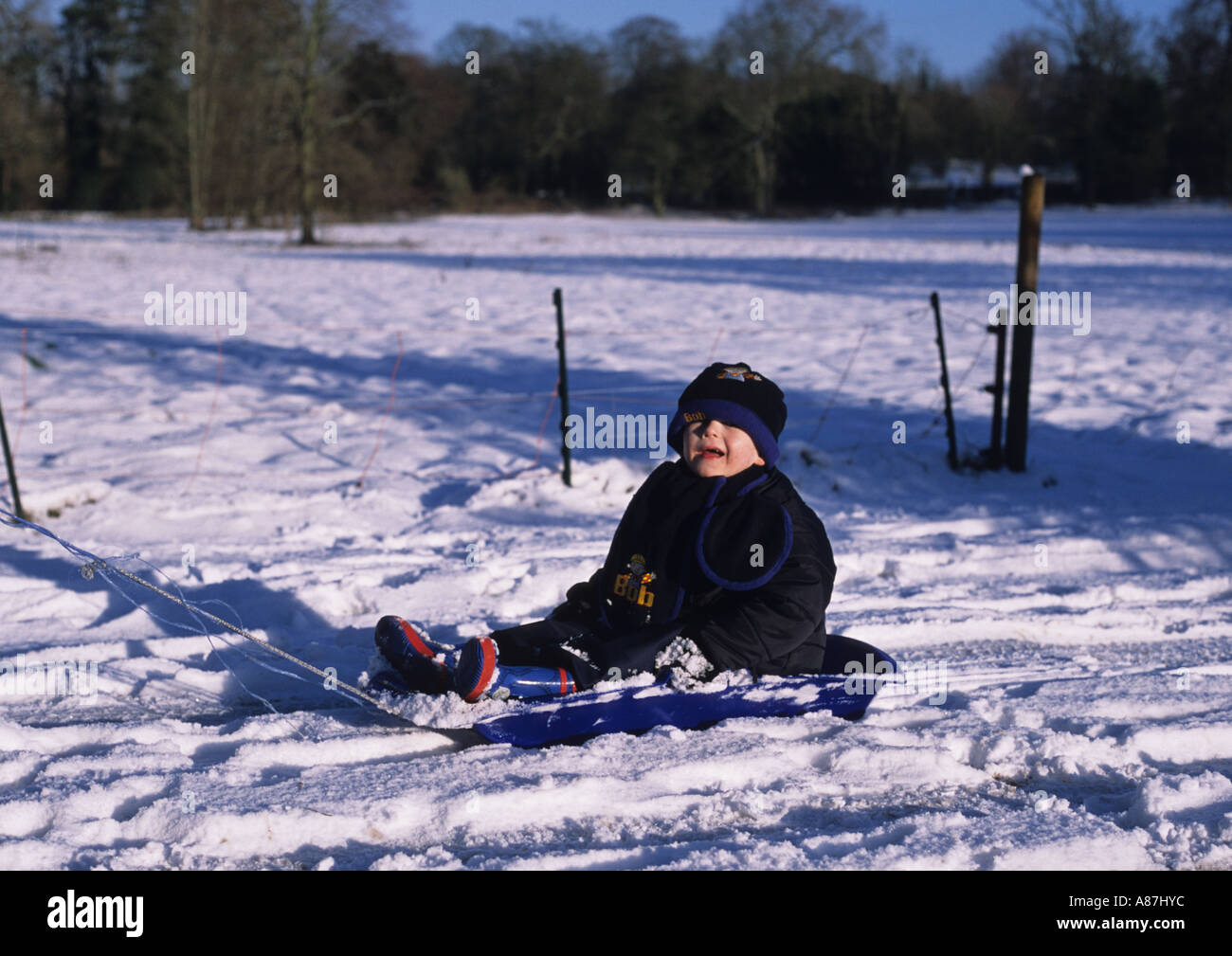 Boy In Snow in the Uk Stock Photo - Alamy