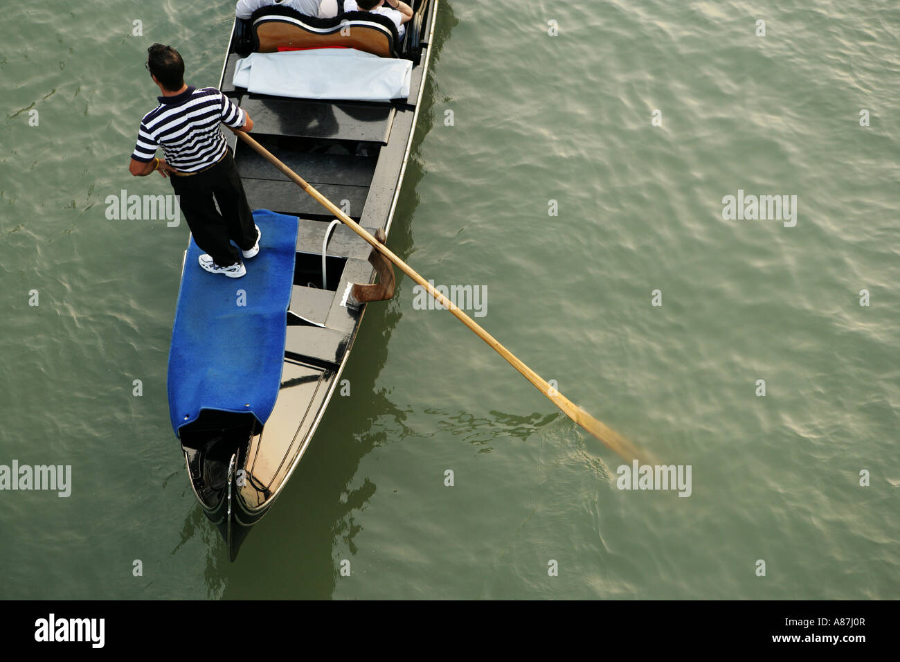Man standing on boat, elevated view Stock Photo - Alamy