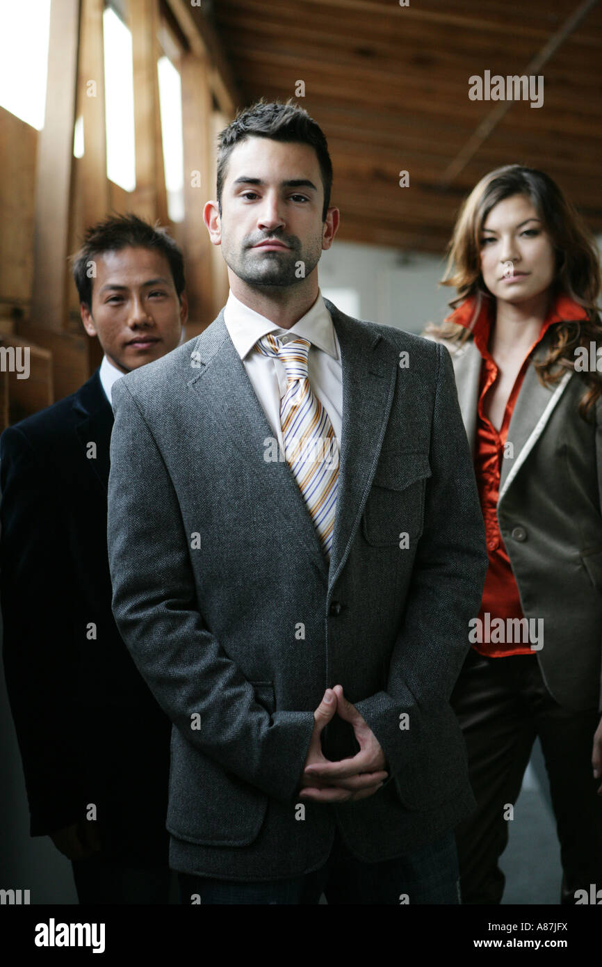 Three business people, caucasian male up front Stock Photo - Alamy
