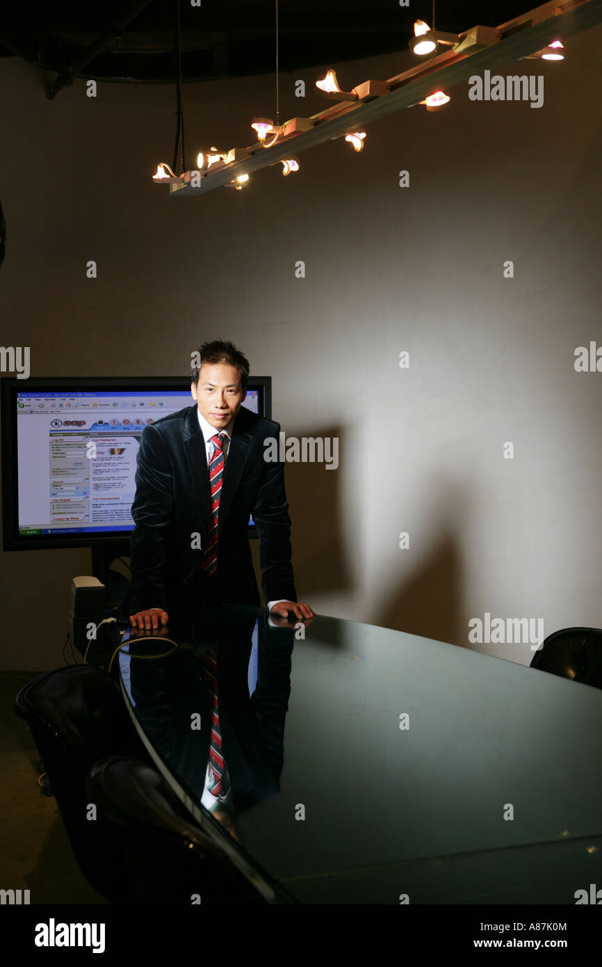 Business man leaning on table hi-res stock photography and images - Alamy
