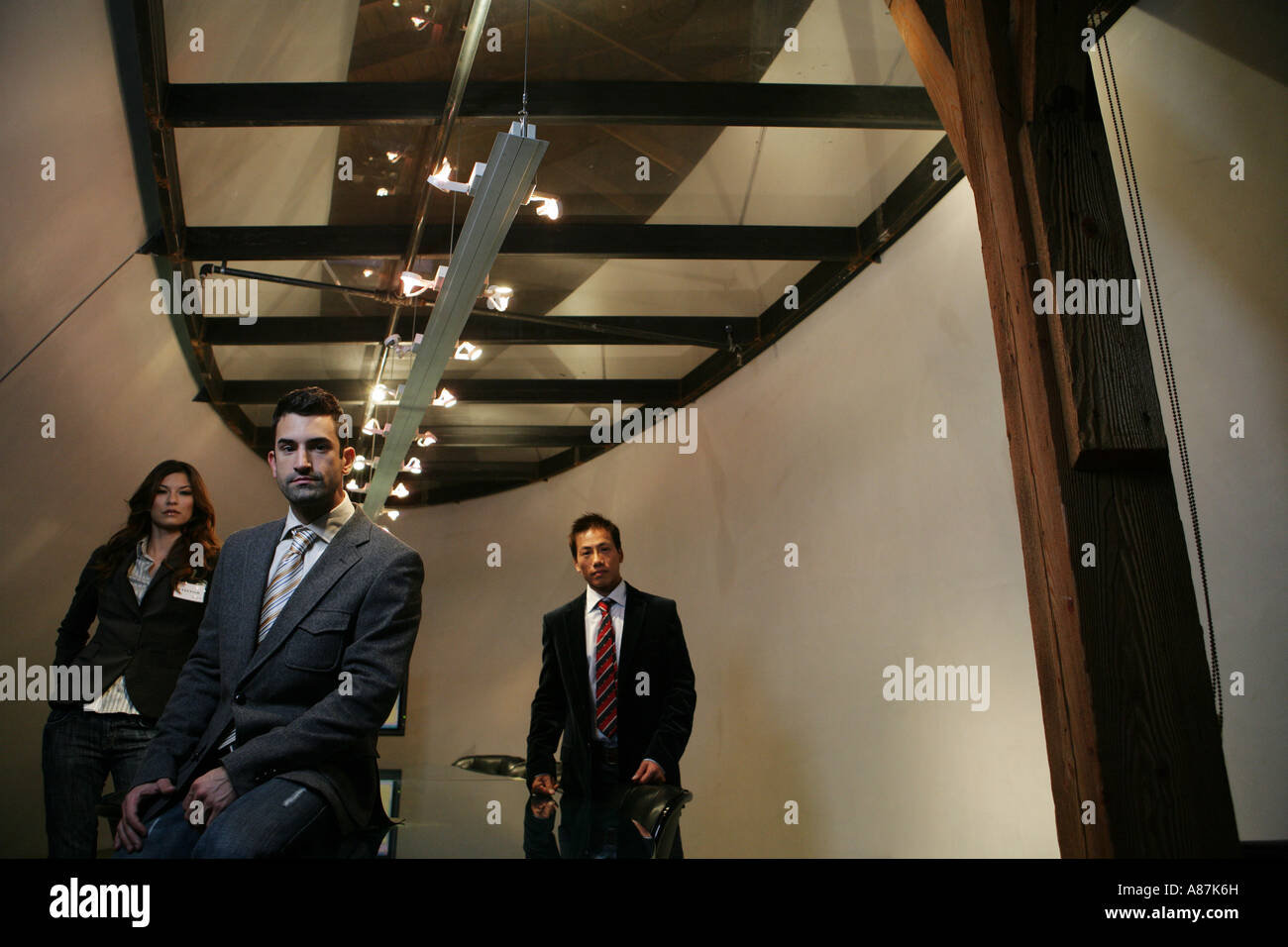 Three people in a conference room Stock Photo - Alamy