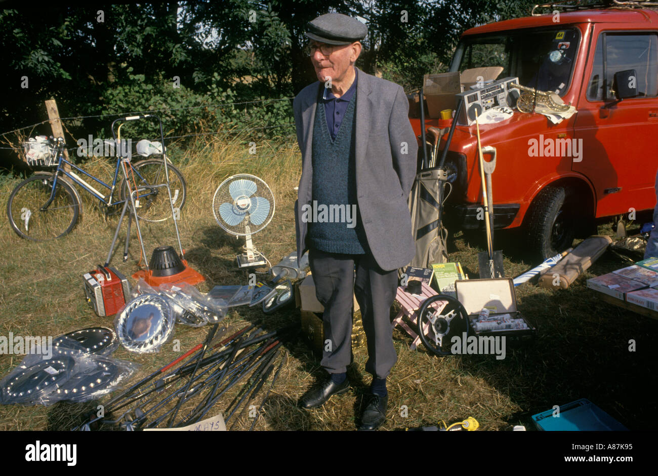 Car boot sale 1990s UK. Old man with possessions he is selling at his ...