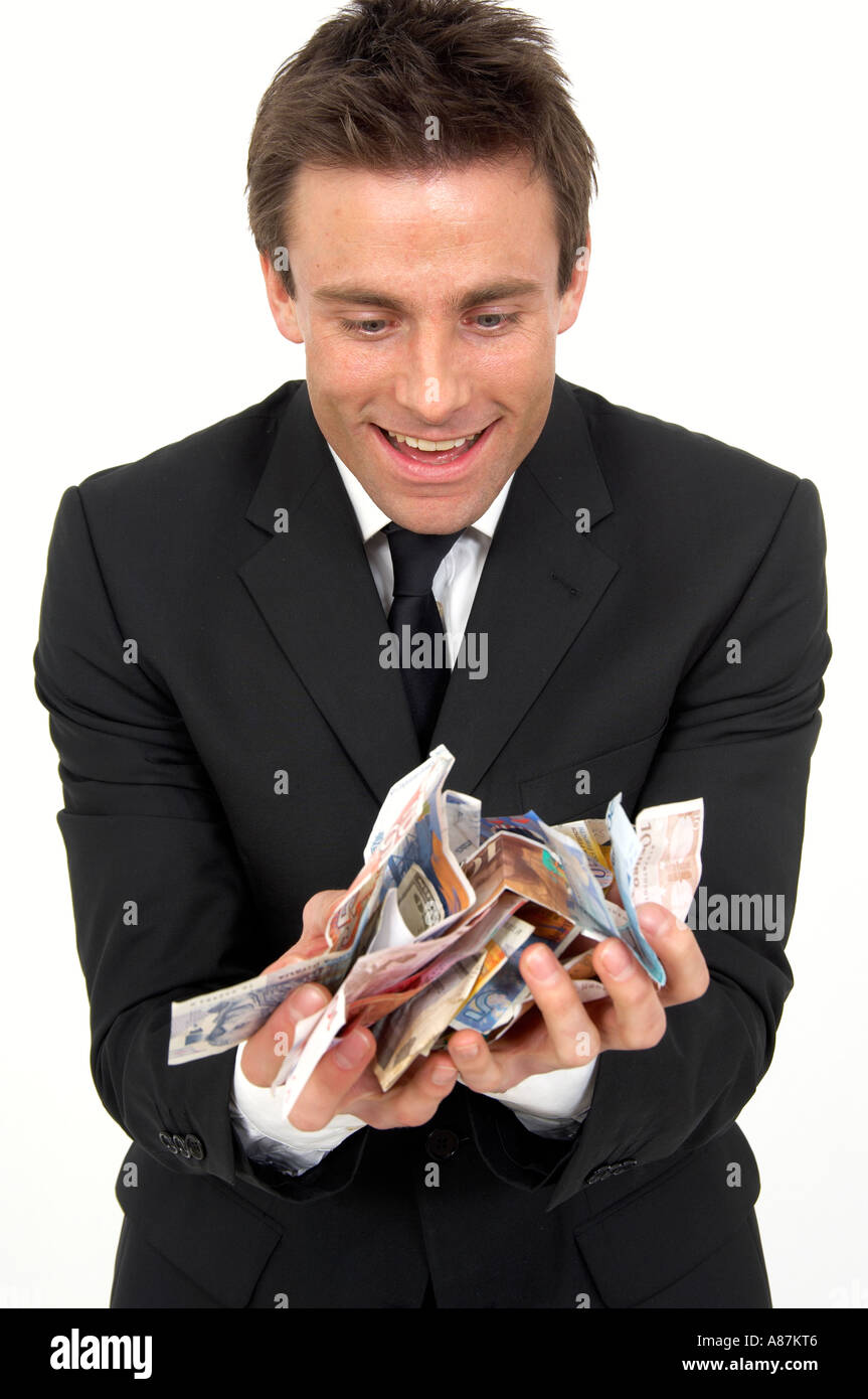 man with hands full of cash Stock Photo - Alamy