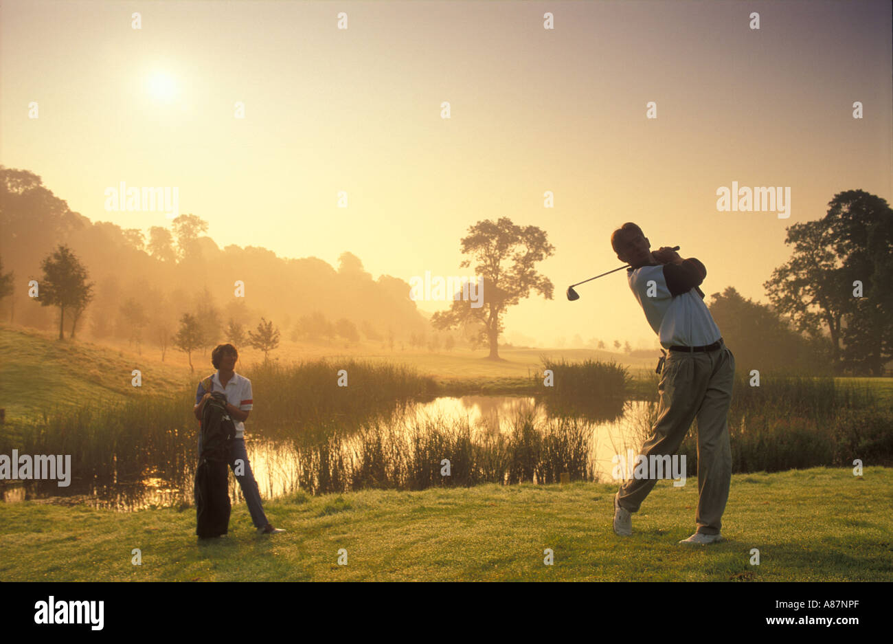 People playing golf Cheshire England UK Stock Photo - Alamy