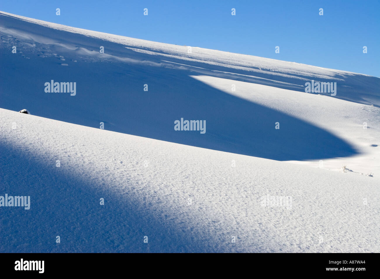 Abstract shadows on snow cornices in Hayden Valley Yellowstone National ...