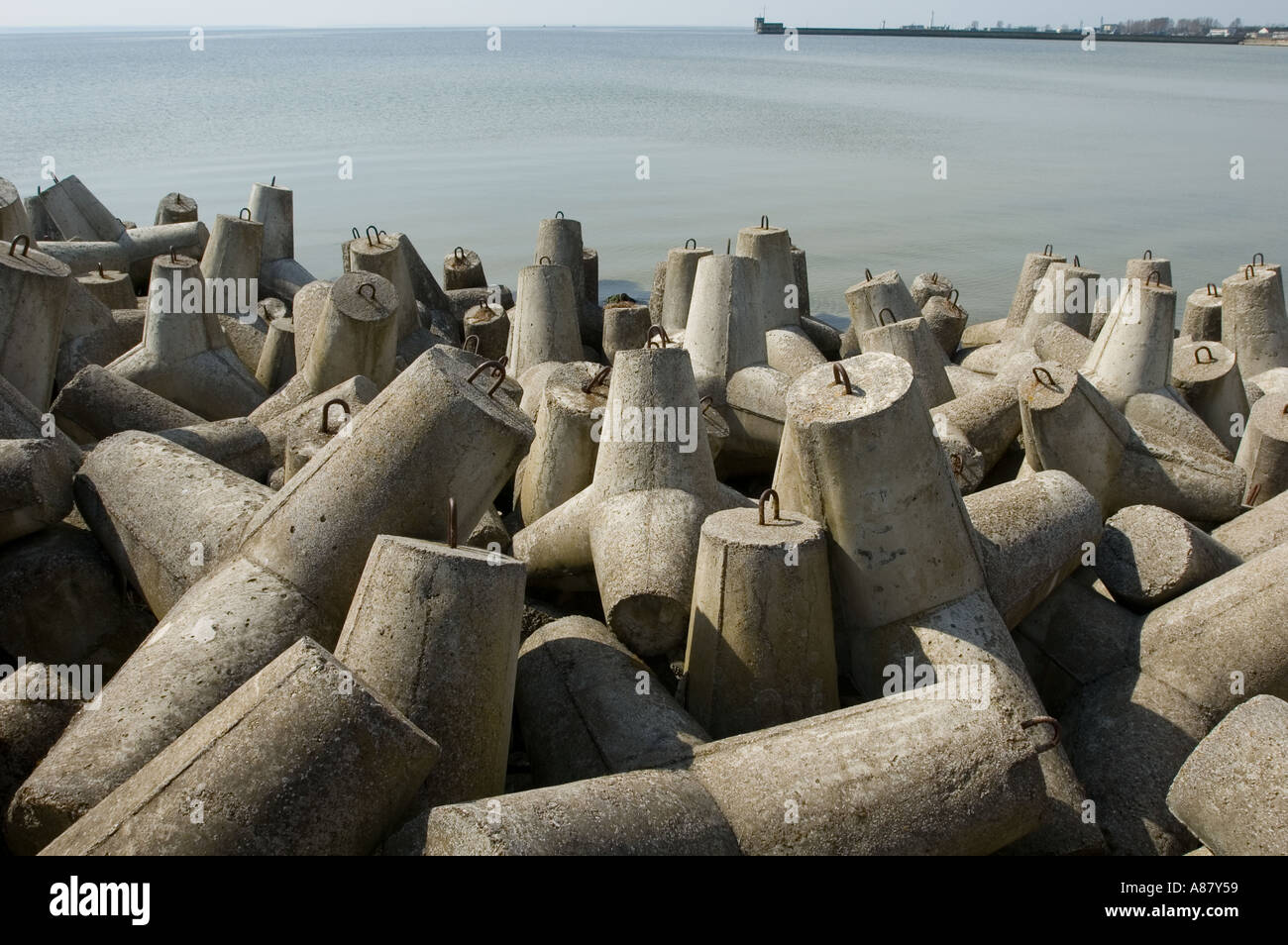 Concrete bulwark blocks and pier on the Hel paninsula coast Baltic See ...