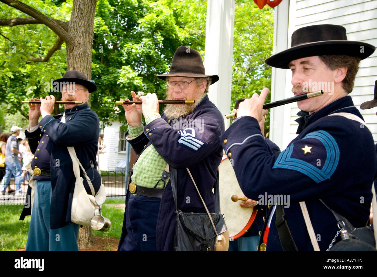Men in uniform playing instruments at the Naper Village settlement ...