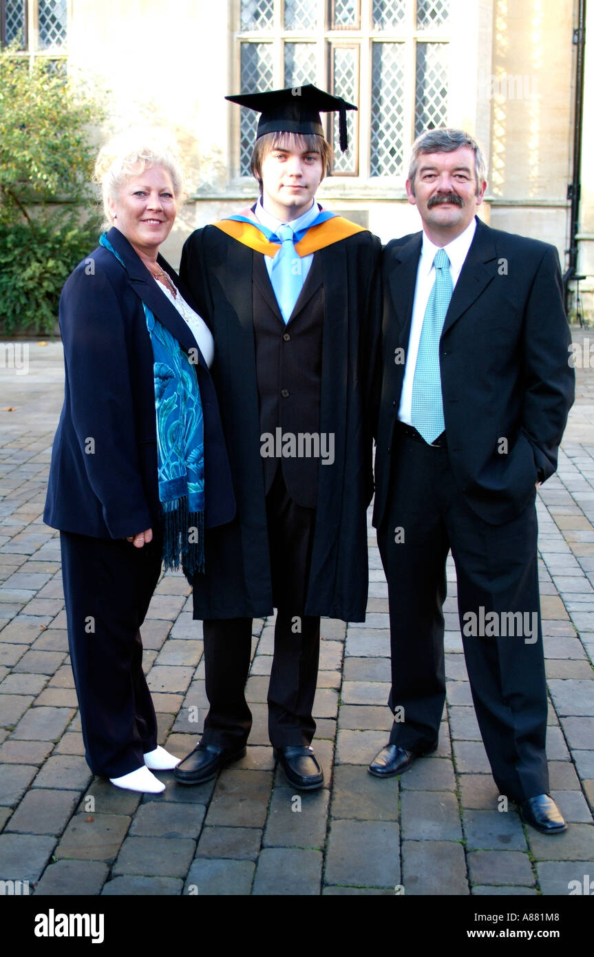 freshly graduated student with proud parents Stock Photo - Alamy