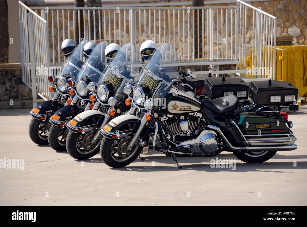 A row of sheriff police motorcycles are parked and lined up ready for ...