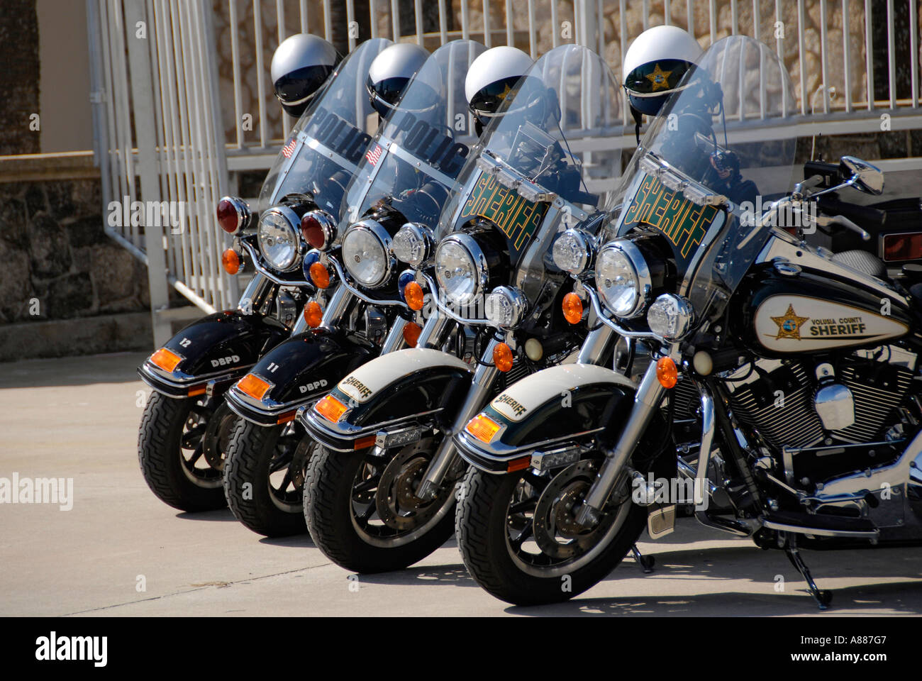 A row of sheriff police motorcycles are parked and lined up ready for ...