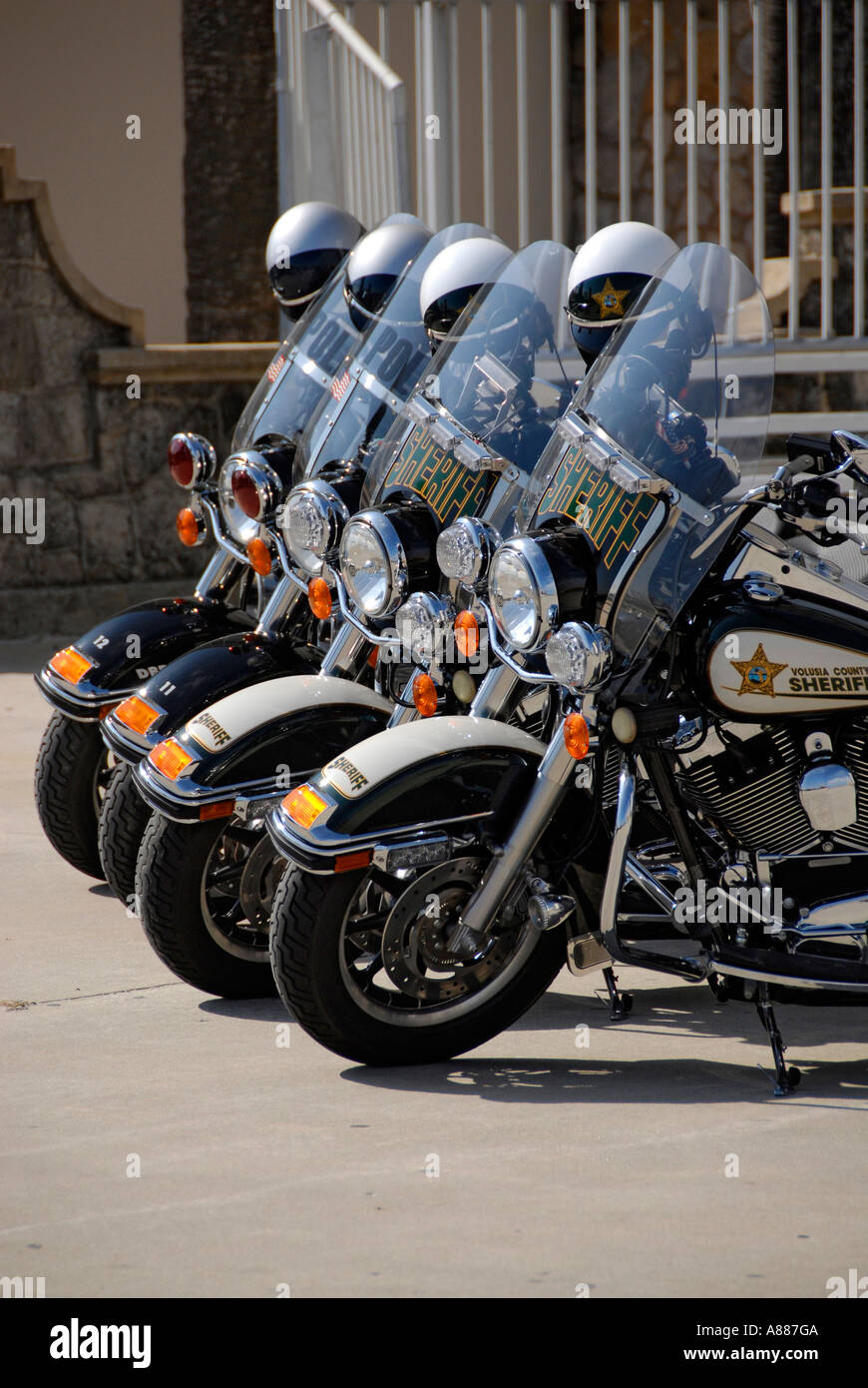 A row of sheriff police motorcycles are parked and lined up ready for ...