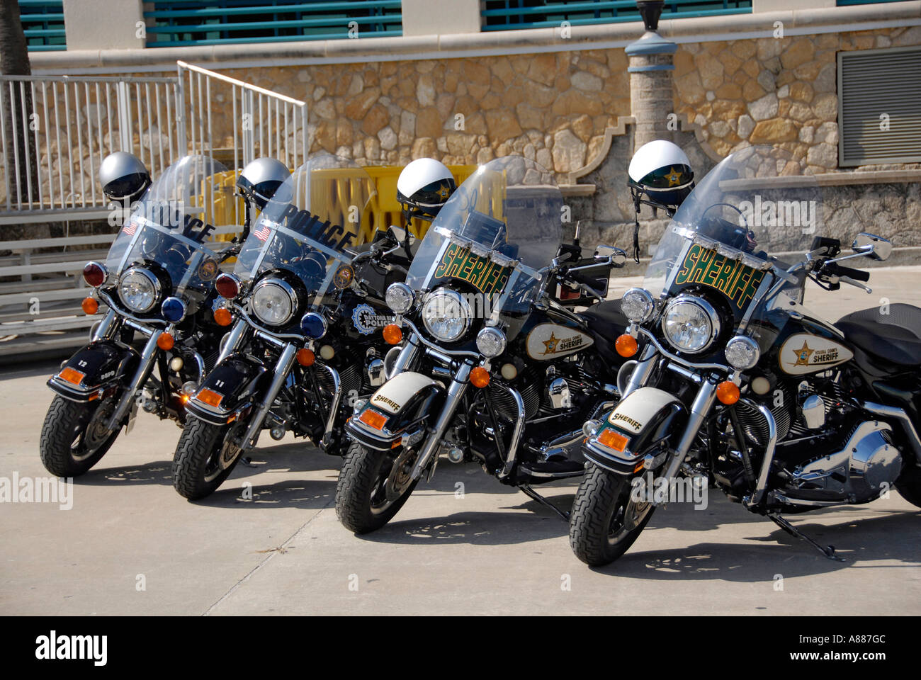 A row of sheriff police motorcycles are parked and lined up ready for ...