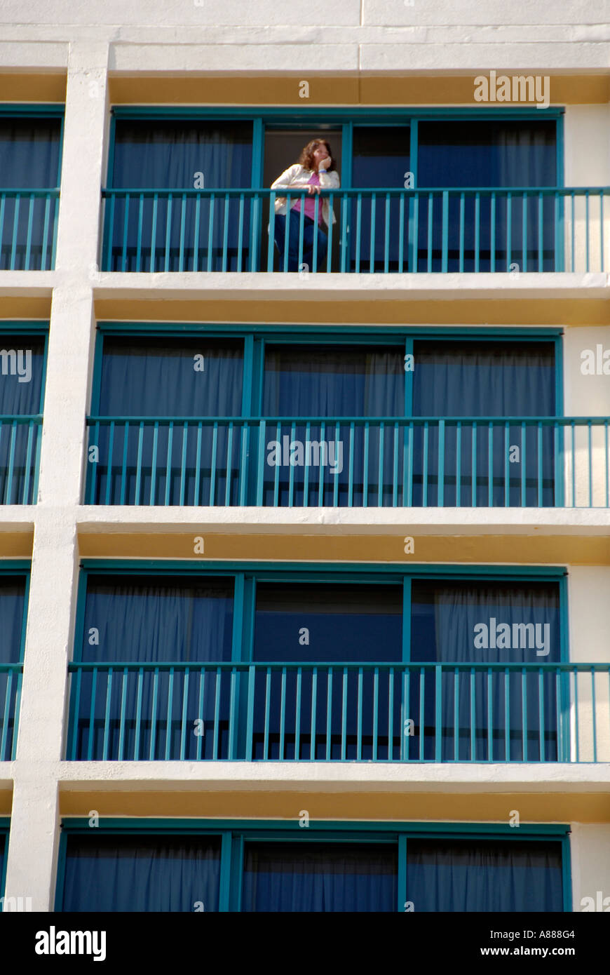 High rise tall building condo condominium motel hotel balcony standing ...