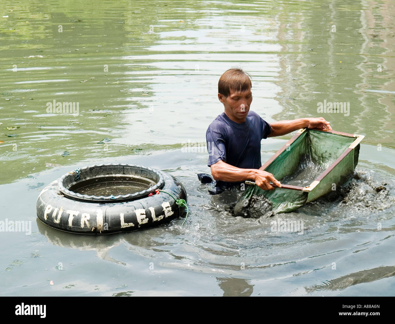 Man fishing in polluted water hi-res stock photography and images - Alamy