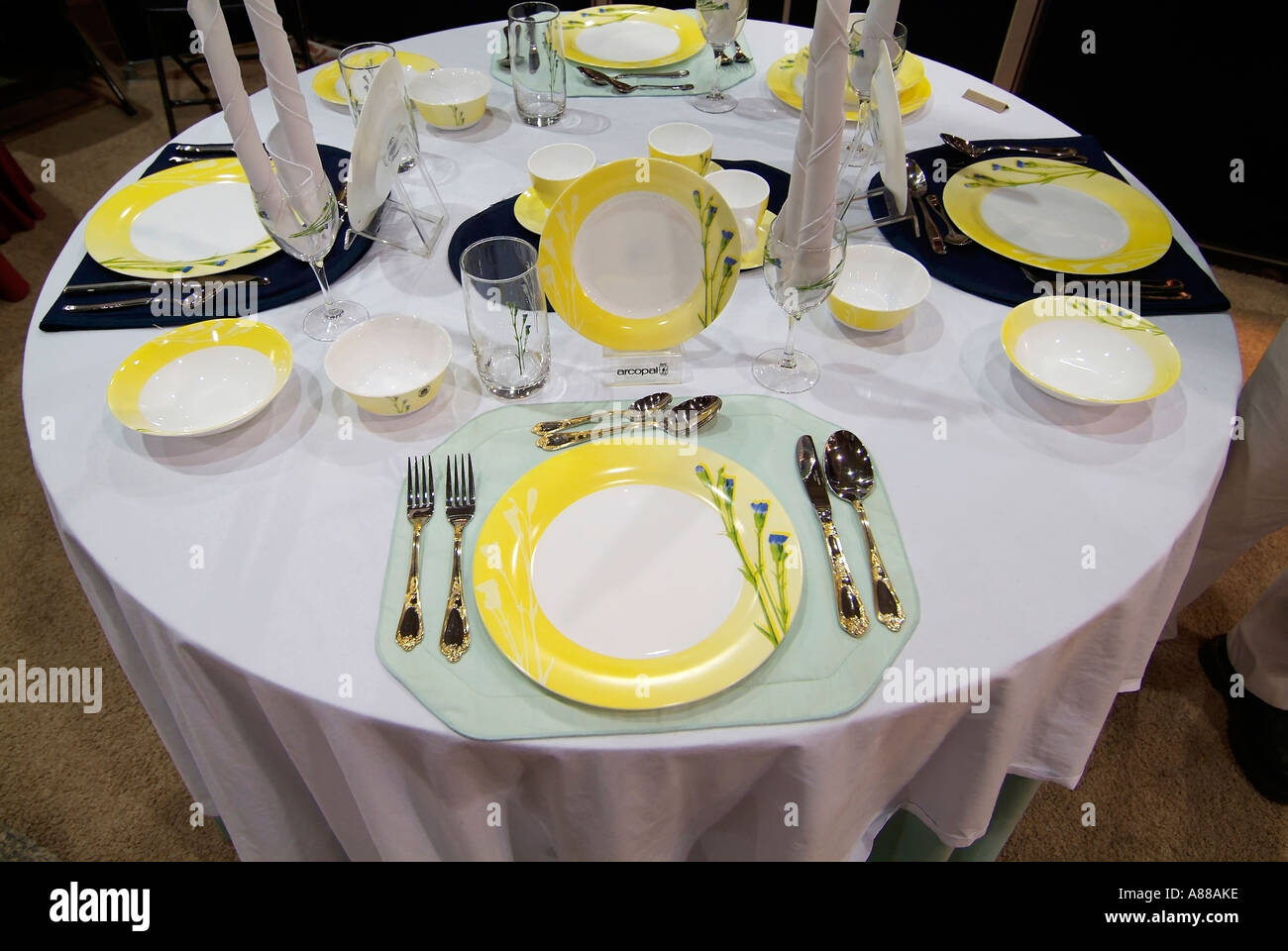 Table set with dishes ready for a meal Stock Photo - Alamy