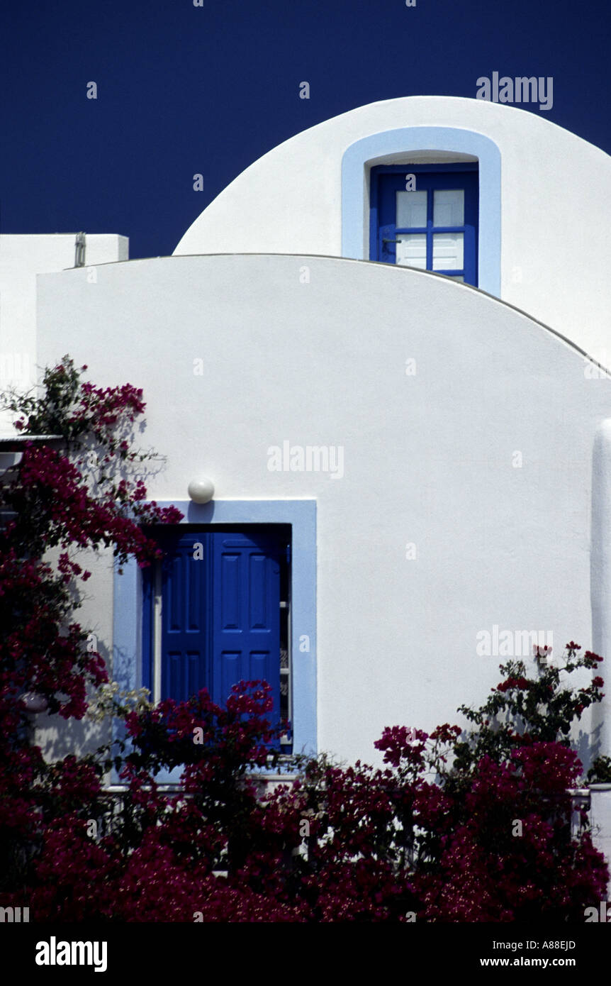 Curved contours of whitewashed house with typical blue paintwork in ...